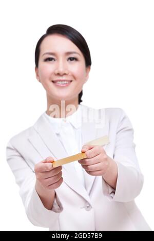 Businesswoman handing bank card out Stock Photo - Alamy
