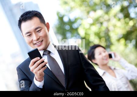 Office workers with smart phones Stock Photo - Alamy