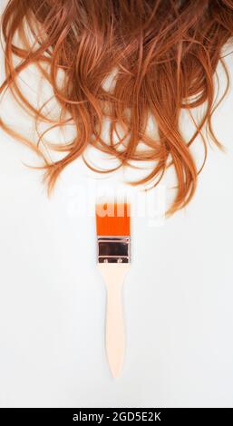 Hair brush with strand on color wooden background Stock Photo - Alamy