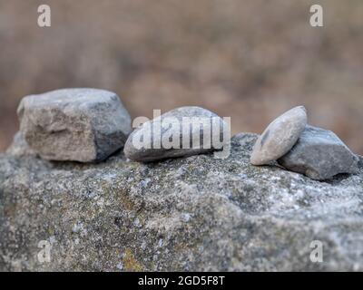A closeup shot of small rocks on the beach and in the water Stock Photo ...
