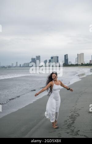 Photo of calm peaceful young woman hold hands chest heart closed eyes ...