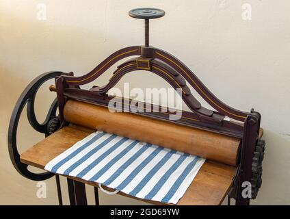 Old iron clothes mangle Stock Photo - Alamy