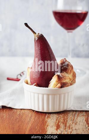 Sweet pear cooked with red wine, delicious homemade dessert Stock Photo ...
