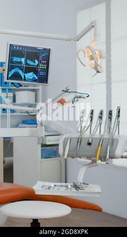 Zoom in shoot of stomatology orthodontist office room with tooth xray ...