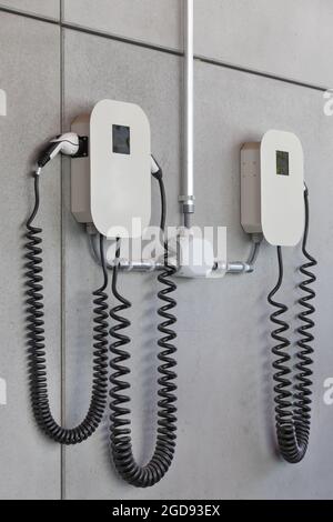electric charger on concrete wall Stock Photo - Alamy
