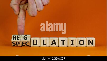 Speculation or regulation symbol. Businessman turns wooden cubes ...