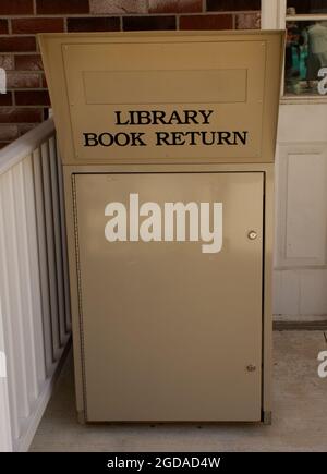 Public library book return drop box Stock Photo - Alamy