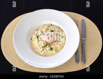 cooked risotto with shrimp tartare in white plate closeup Stock Photo ...
