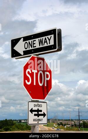 One Way, Stop, and Divided Highway Signs Stock Photo - Alamy