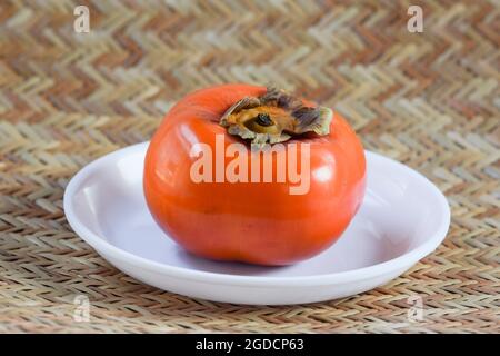 Sharon fruit or Persimon fruit isolated on a white studio background ...