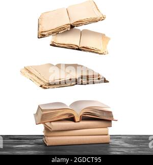 Stacked and flying books on white background, collage Stock Photo - Alamy
