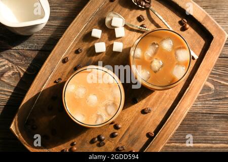 Composition with glasses of tasty iced coffee on color background Stock ...