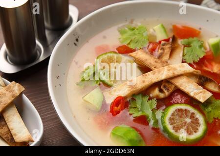 Plate of tasty Sopa de Lima soup on table, closeup Stock Photo - Alamy