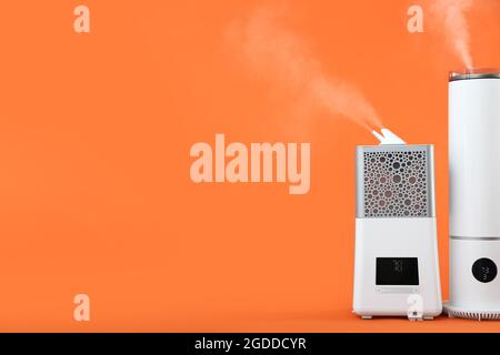 Set of modern air humidifiers on white background Stock Photo - Alamy