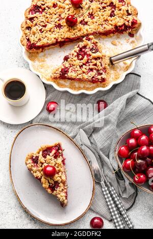 Composition with tasty cherry pie and cup of tea on color wooden ...