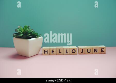 Hello June alphabet letter on pink glitter background Stock Photo - Alamy