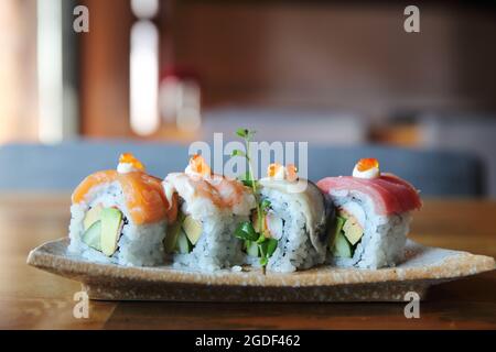 Mix maki sushi roll japanese food in black background Stock Photo - Alamy