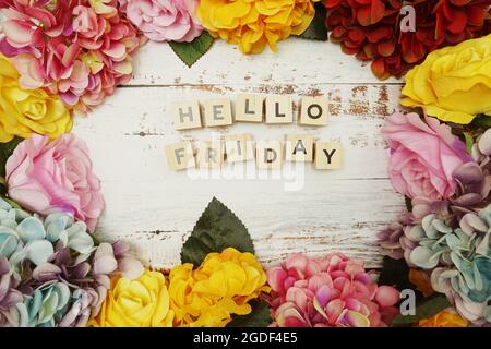 Hello Friday alphabet letter with colorful flowers border frame on ...