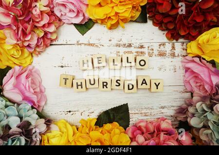 Hello Thursday alphabet letter with colorful flowers border frame on ...