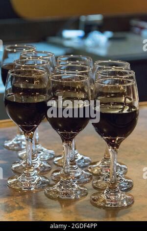 Glass goblets filled with red wine at night social event Stock Photo ...