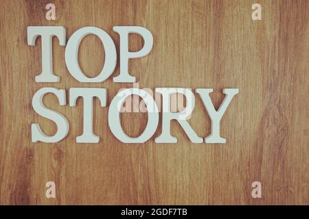 Top Story alphabet letters on wooden background Stock Photo - Alamy