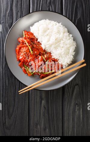 Jeyuk Bokkeum or Dweji Bulgogi with rice close-up in a plate on the ...
