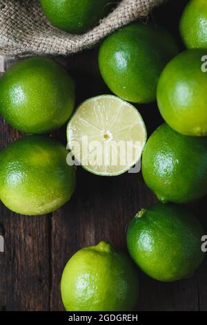 Top view of sliced lime on green background, banner Stock Photo - Alamy
