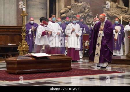 Dean of the College of Cardinals Giovanni Battista Re holds the Holy ...