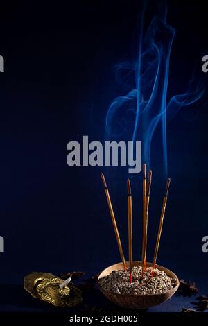 Friday 13. Some incense lit emitting a fragrant smoke with the ...