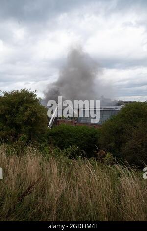 North Shields, UK, 13 August 2021. Firefighters fight large fire on ...