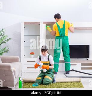 Cleaning professional contractors working at house Stock Photo - Alamy