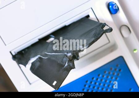 melted and broken floppy disk in a drive Stock Photo - Alamy
