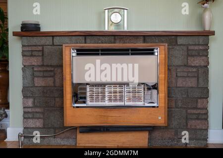 1980's traditional wood surround gas fire built into stone fireplace ...
