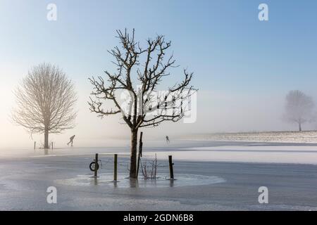 Ice skating on frozen floodplains in the Netherlands Stock Photo - Alamy