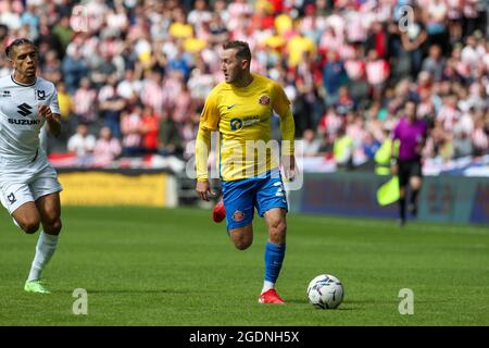 MILTON KEYNES, UK. AUG 14TH Milton Keynes Dons Mo Eisa is fouled by Sunderland's captain Corry ...