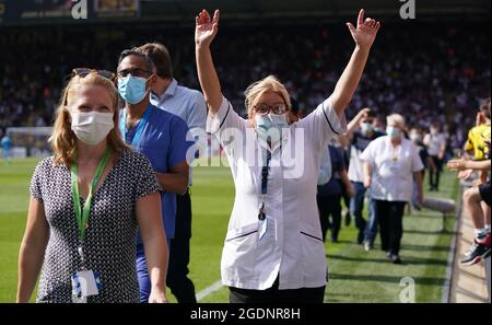 Fans applaud staff from an NHS Trust at half time during the Premier ...