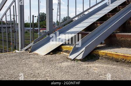 Outdoor stairs with ramp and metal railings Stock Photo - Alamy