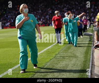 Fans applaud staff from an NHS Trust at half time during the Premier ...