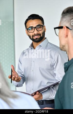 Group leader having a team discussion with co-workers Stock Photo - Alamy
