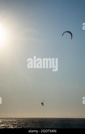 Surfer Catching Air at Sunset Stock Photo - Alamy