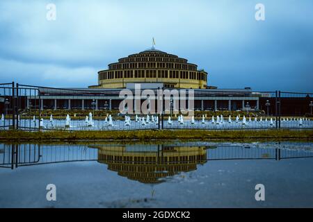 Centennial Hall reflected in puddle Stock Photo - Alamy
