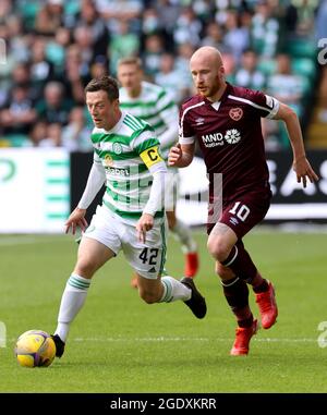 Celtic's Callum McGregor and Heart of Midlothian's James Penrice (right ...