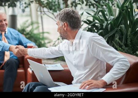 business people shaking hands firmly. concept of cooperation. close-up ...