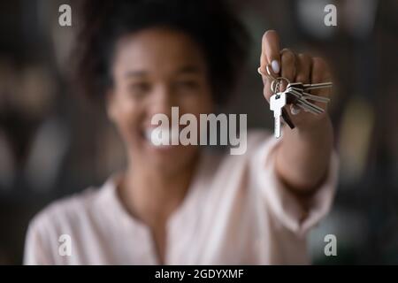 Close up of woman show keys to new home Stock Photo - Alamy