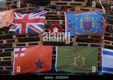 Flags (clockwise from top left) a Union flag, a loyalist paramilitary ...