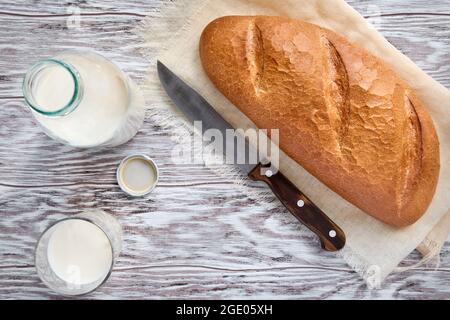 glass of milk and toasted bread on table Stock Photo - Alamy