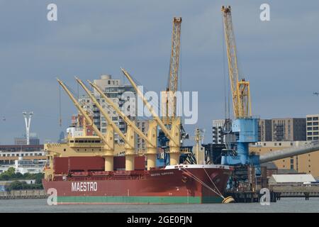 Cargo vessel unloading raw sugar cane at the Tate & Lyle Sugars plant ...