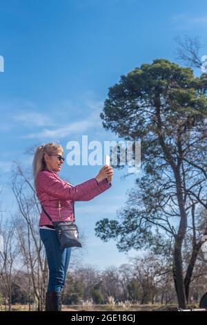 cropped view of woman taking on knitted socks at morning Stock Photo ...