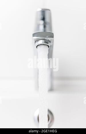 Freiburg, Germany. 09th Aug, 2021. Water runs out of a tap. Credit ...