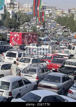 Kabul, Afghanistan. 15th Aug, 2021. People rush to their homes after ...